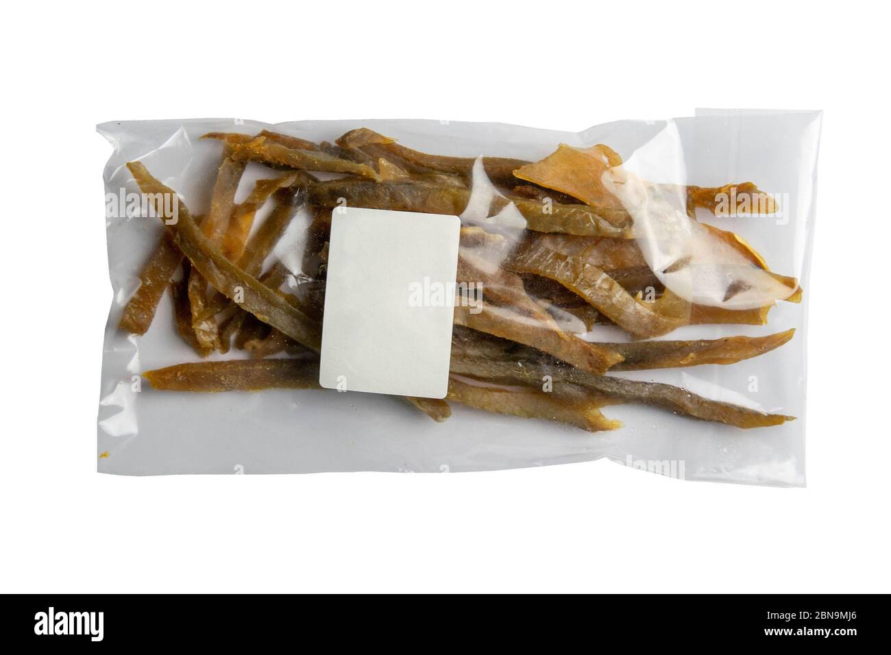 Dried carp fish sticks in a transparent package with a white label ...