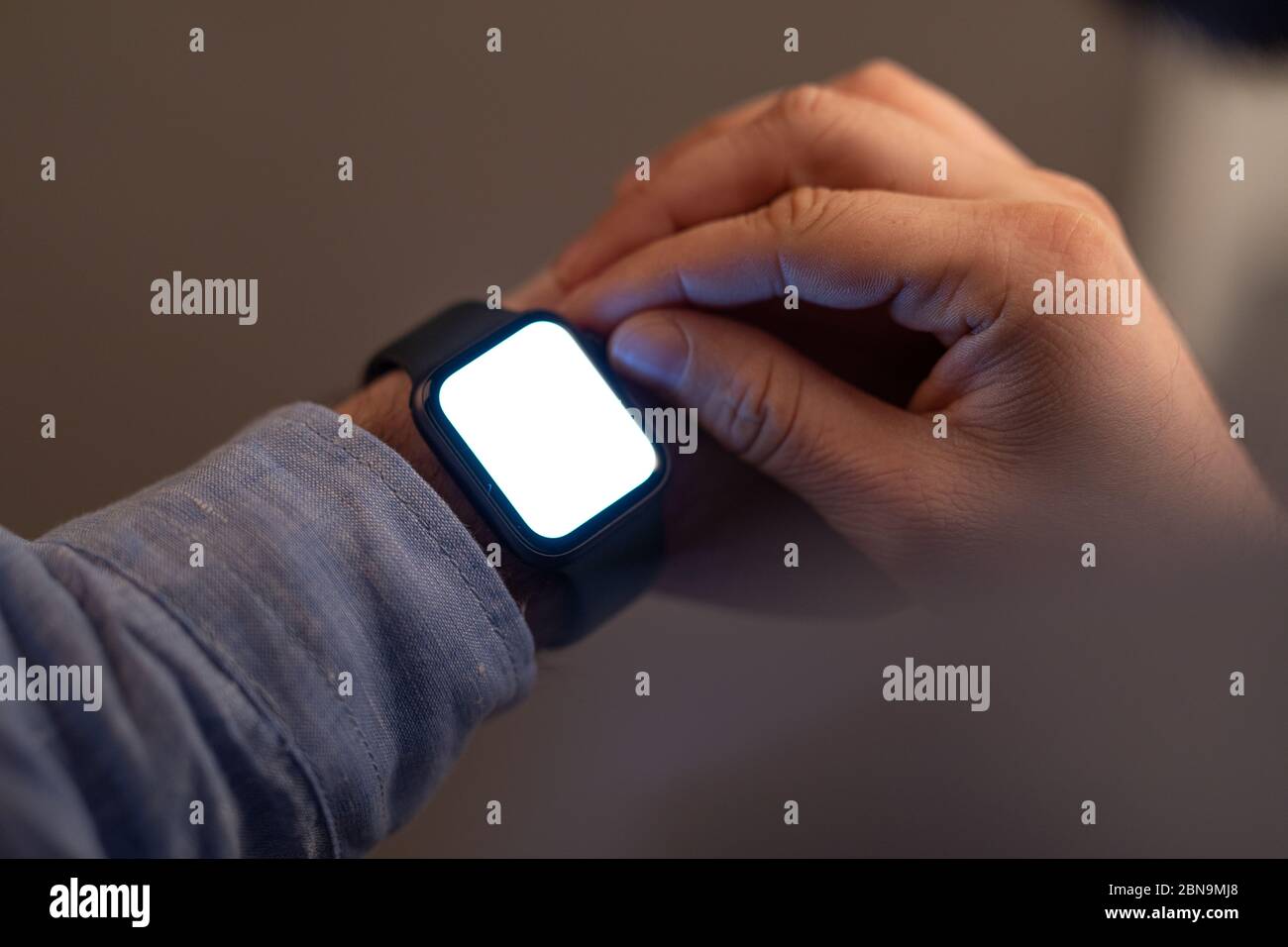 A Close up of Businessman's hand looking at hand watch Stock Photo - Alamy