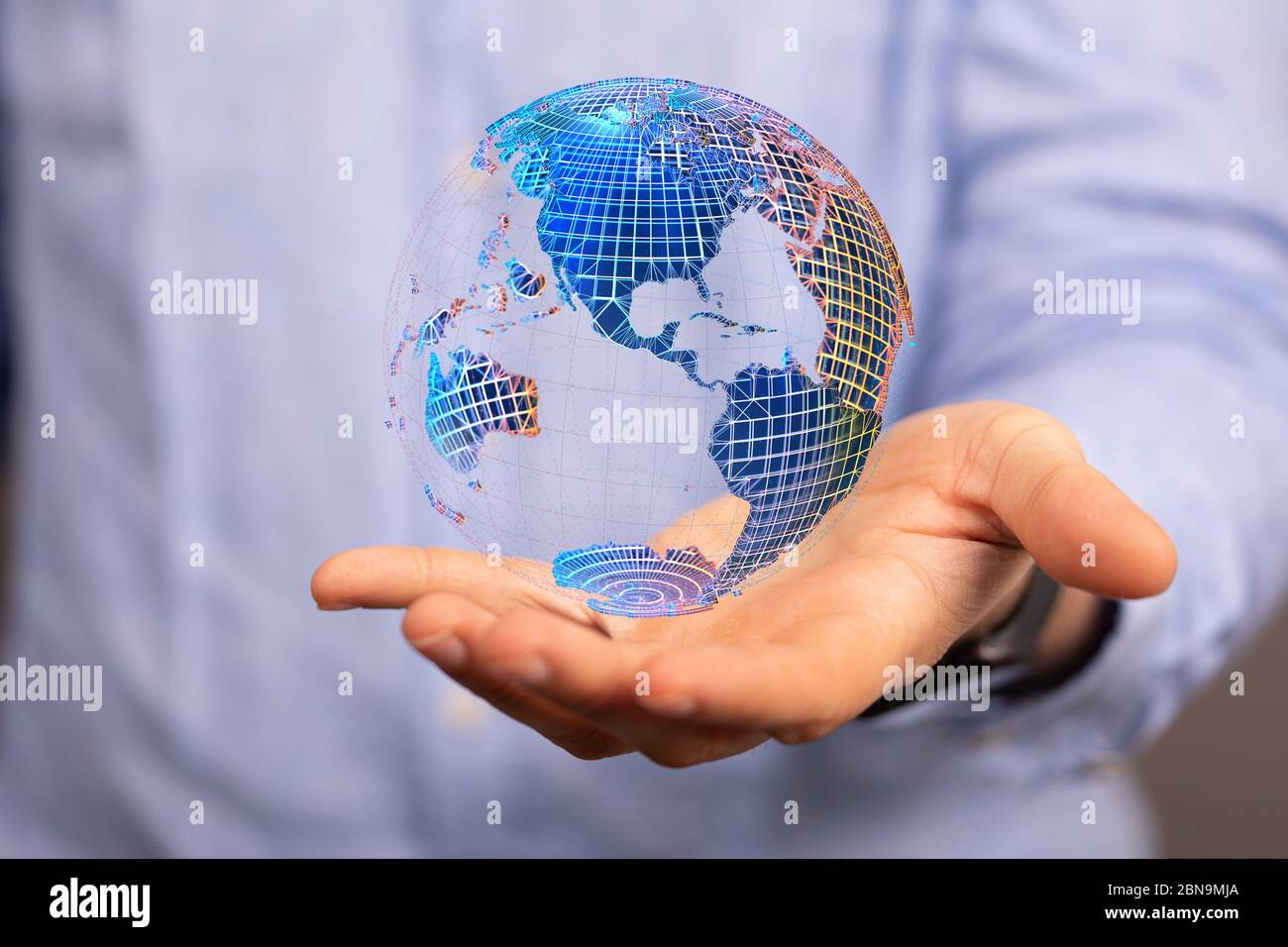 Human Hand Holding The World In Hands Stock Photo - Alamy
