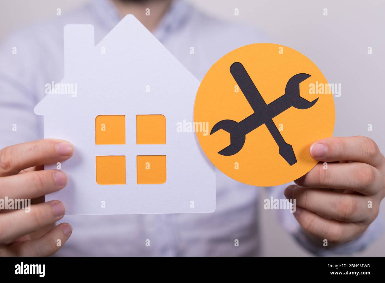 A house managment fixing paper white Stock Photo - Alamy