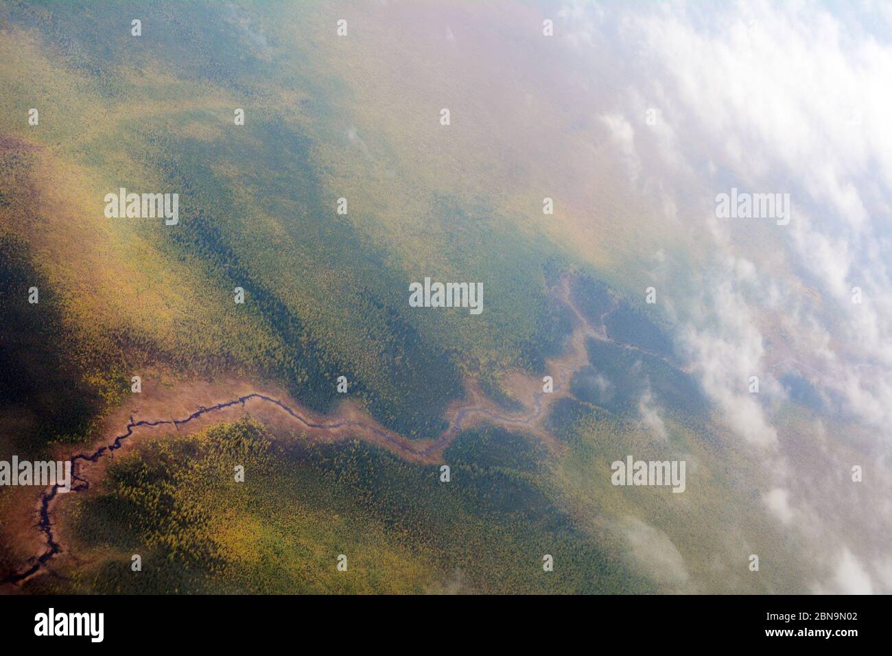 Aerial of the Abitibi River, muskeg and boreal forest in autumn, south ...