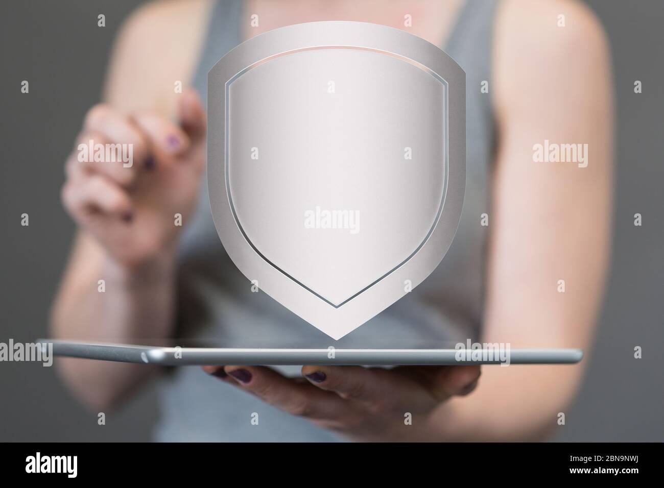 A shield protection concept holding in hand Stock Photo - Alamy