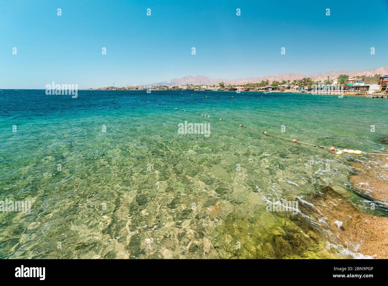Red Sea Dahab blue water with mountainy in the background Stock Photo ...