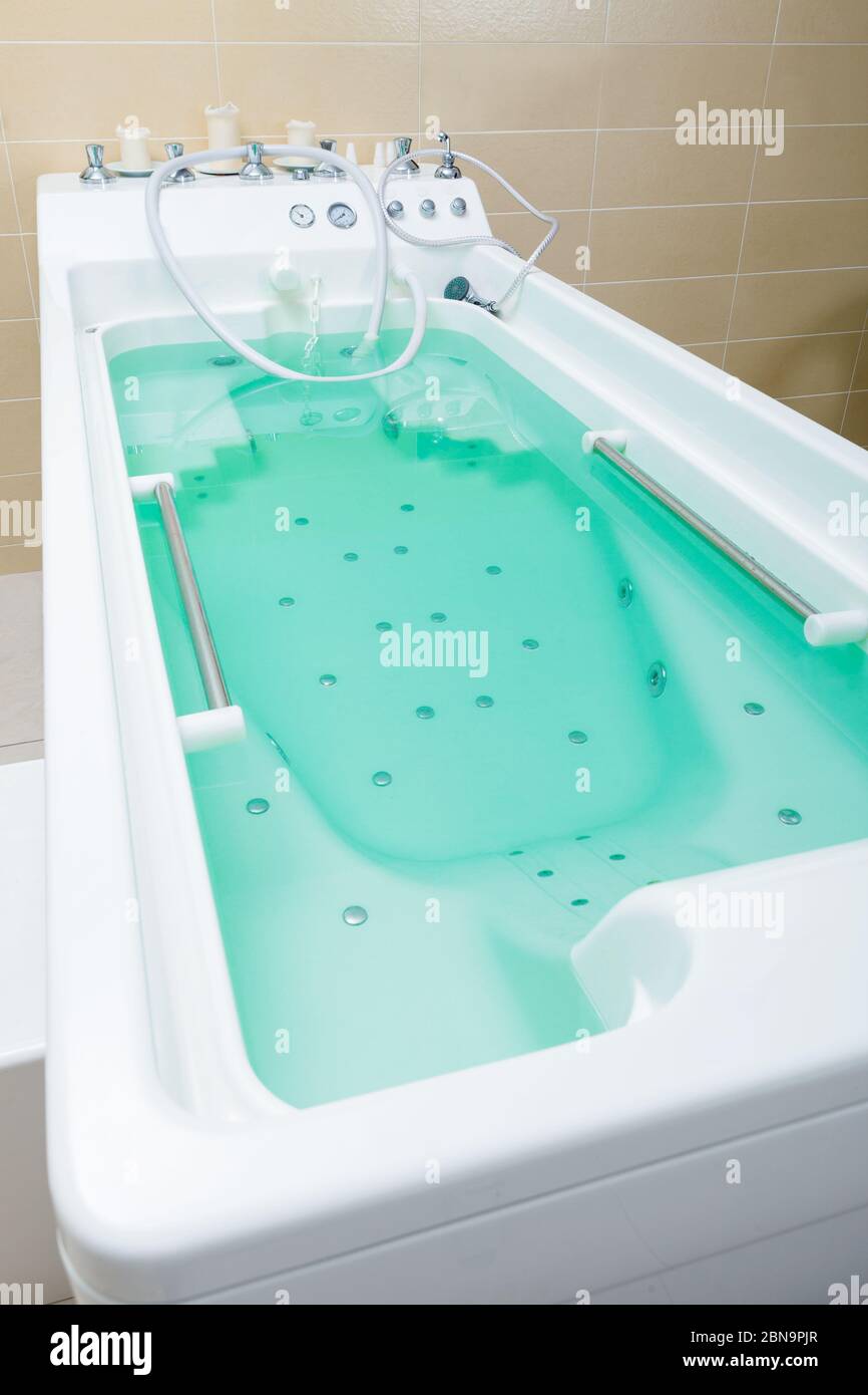 beautiful and white jacuzzi filled with water Stock Photo - Alamy