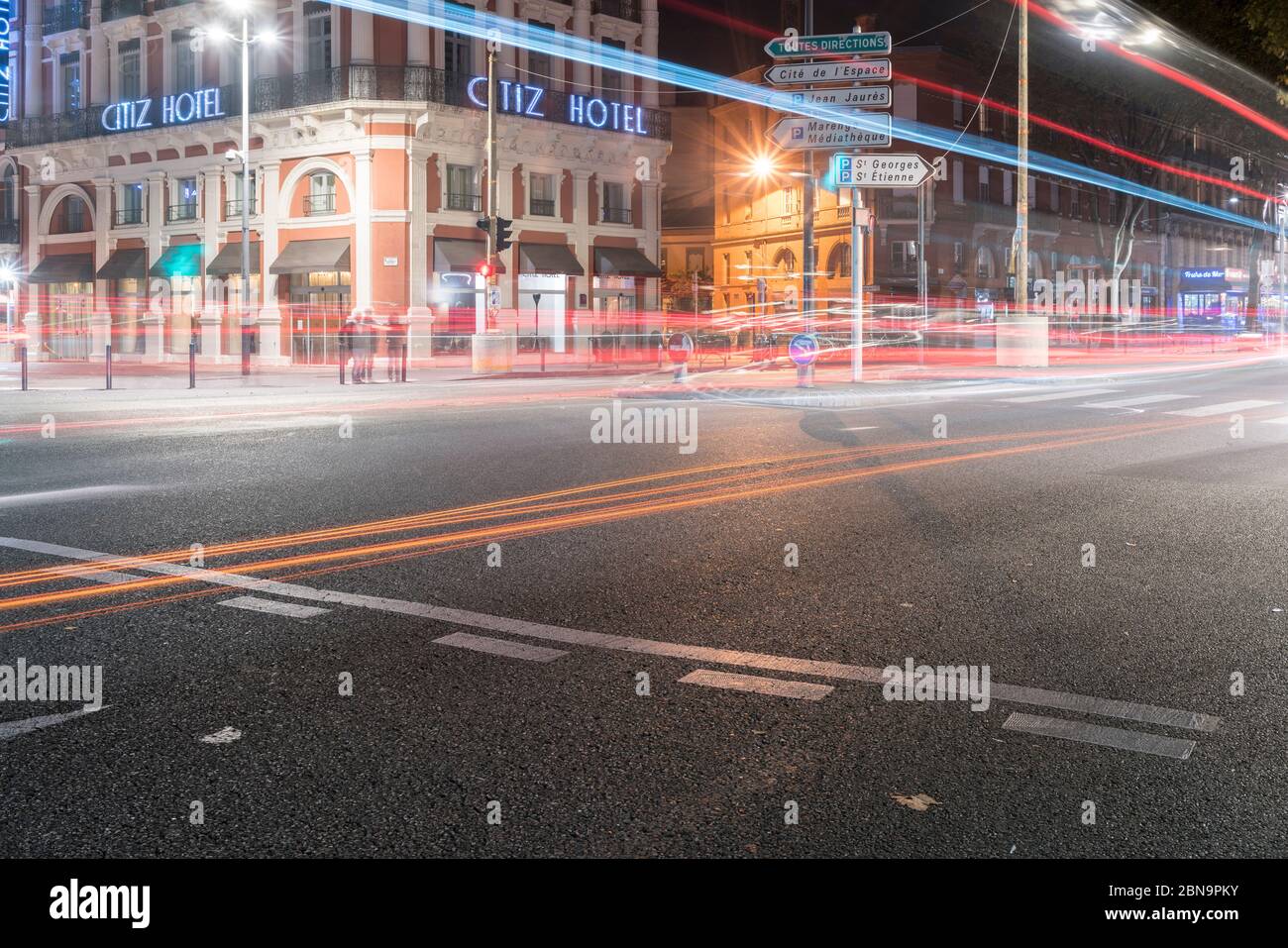 View of street long exposure at night with bars Stock Photo - Alamy
