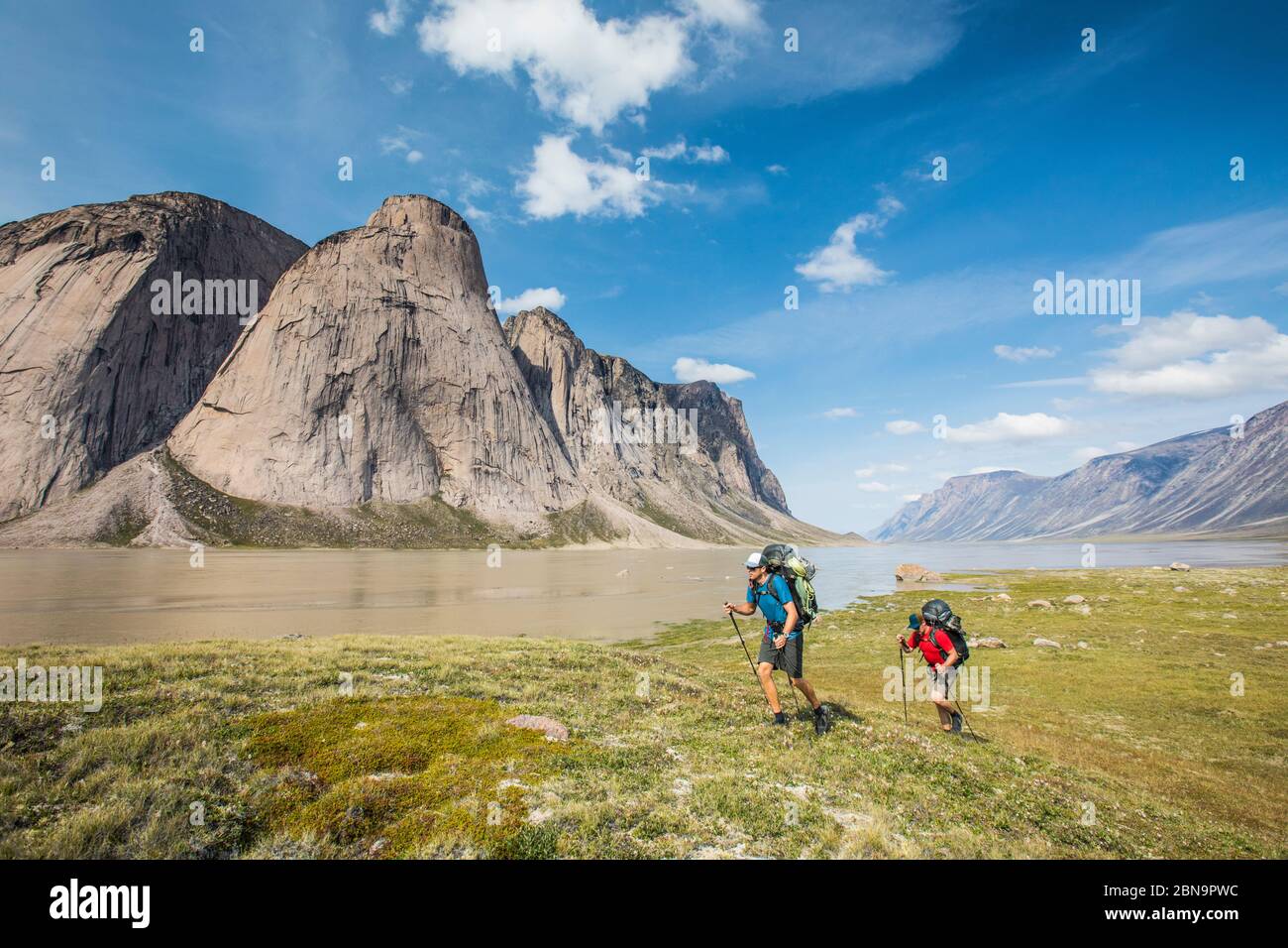 Backpackers hike over arctic tundra in Akshayak Pass Stock Photo - Alamy