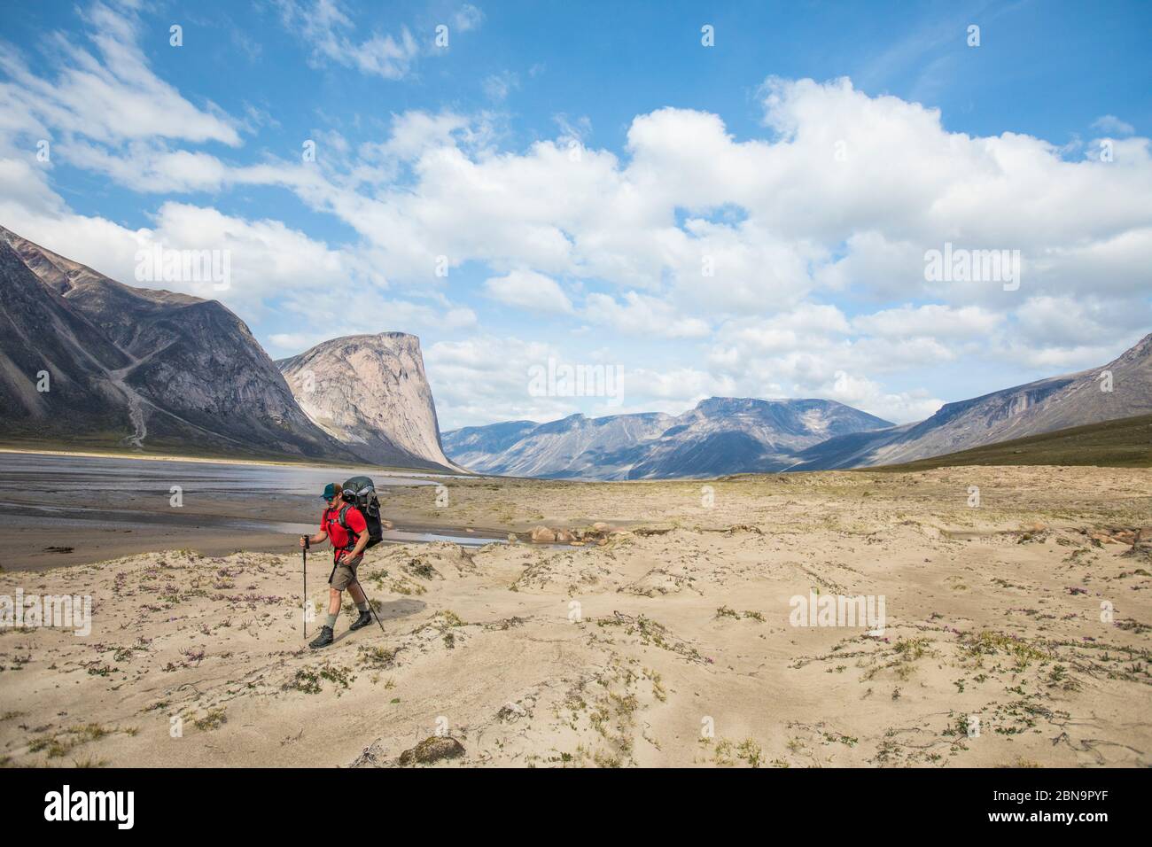 Man hiking next to the Owl River in Akshayak Pass Stock Photo - Alamy
