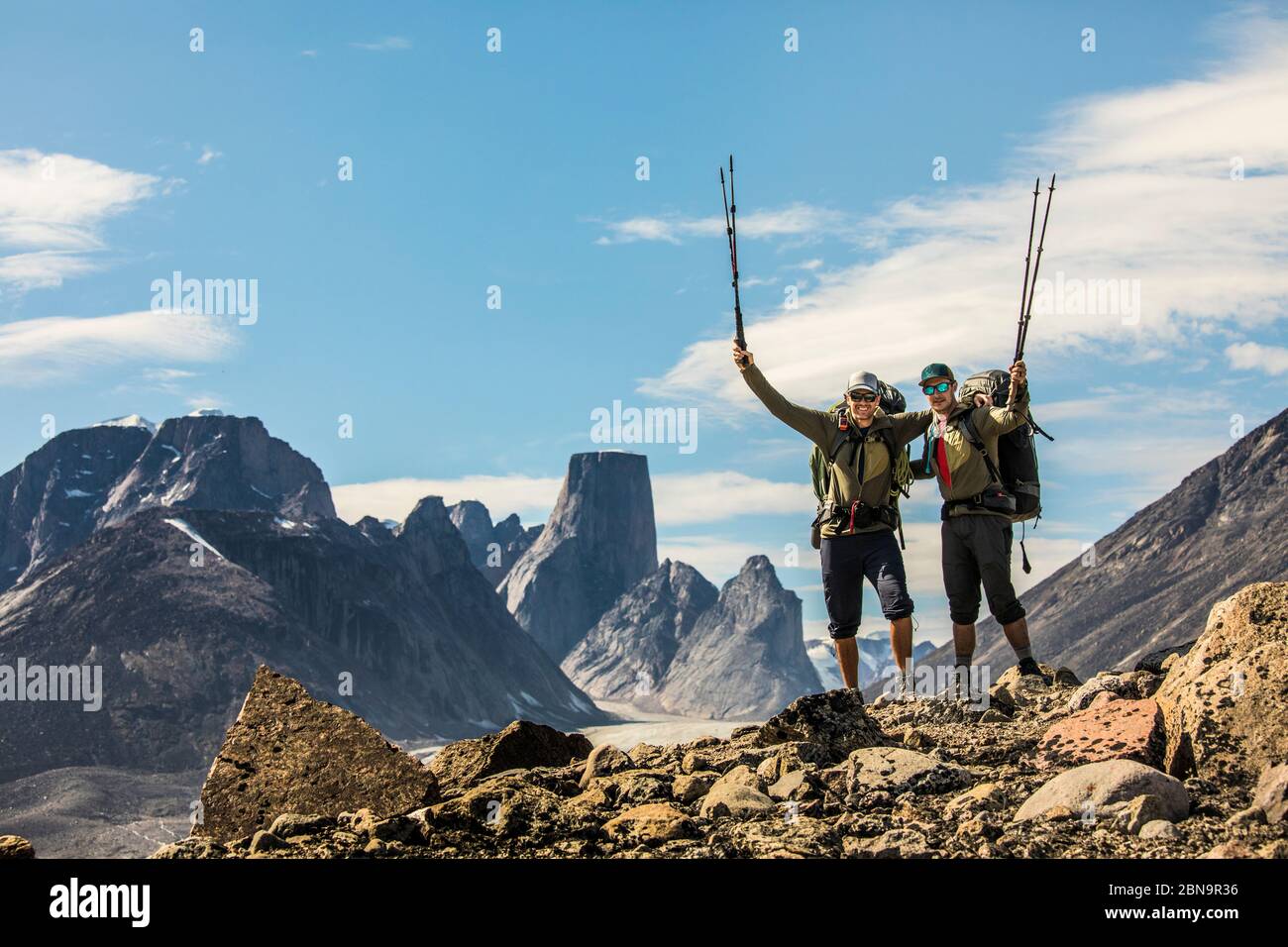 Portrait of two backpackers on mountain ridge in Akshayak Pass Stock ...