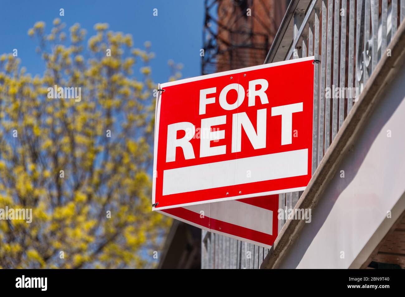 For rent sign posted in front on balcony fence Stock Photo - Alamy