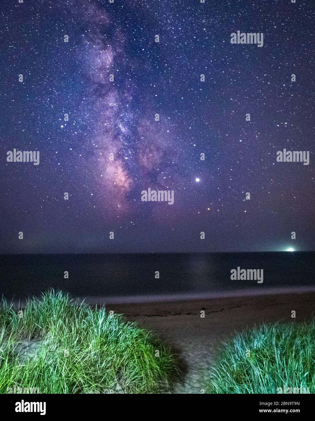 Beach path leading to the ocean and Milky Way sky above Stock Photo - Alamy