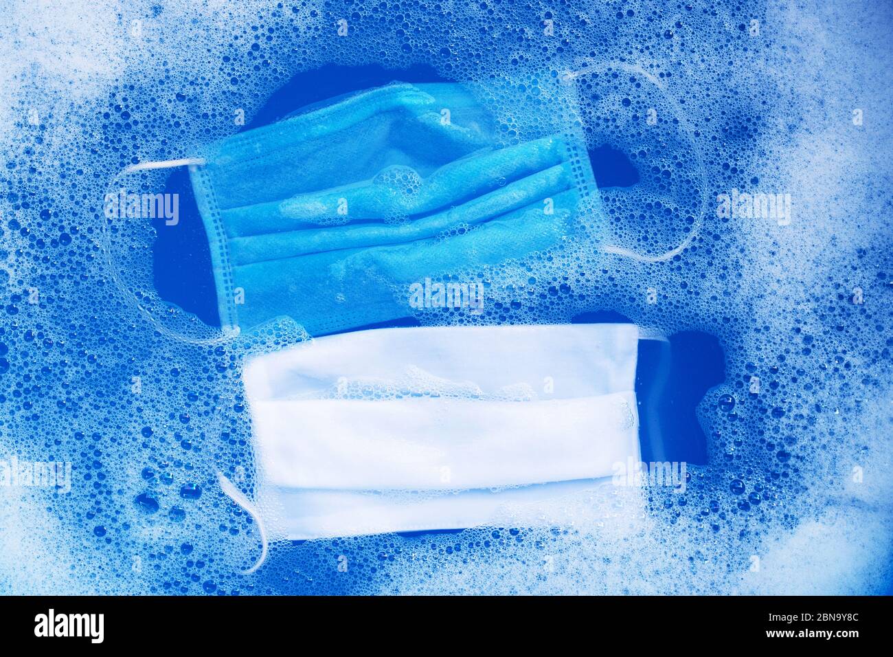 Protective medical mask with cloth mask soak in powder detergent water ...