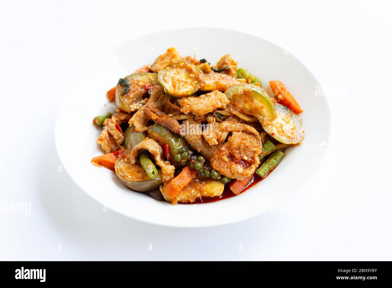 Thai food, Hot and spicy stir-fried pork with herbs Stock Photo - Alamy