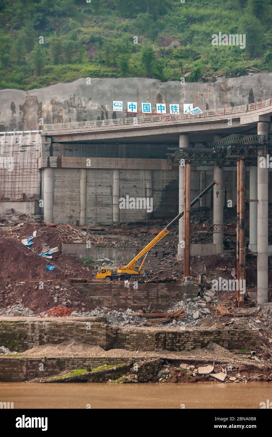 Fengdu, Chongqing, China - May 8, 2010: Yangtze River. Crane works in ...
