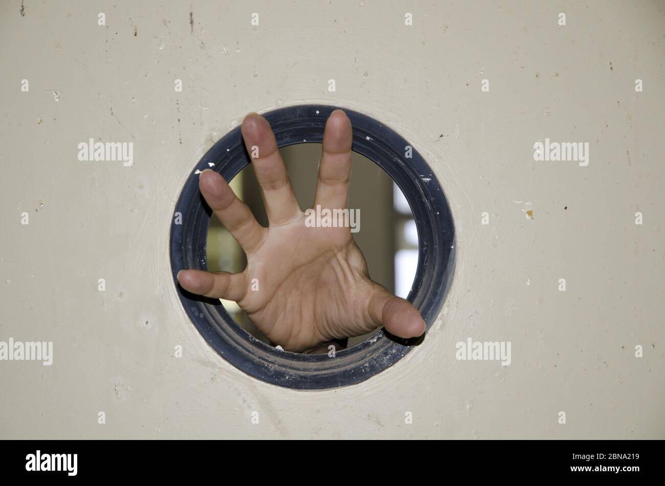 Hand in a hole hi-res stock photography and images - Alamy
