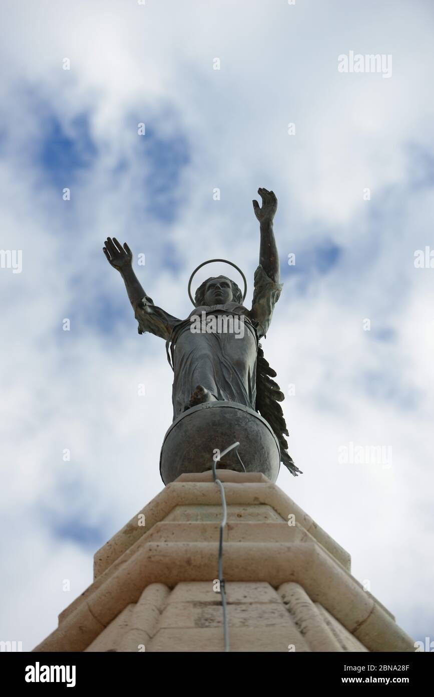 A statue of an Angel at the top of the Bell tower of St. Anastasia ...