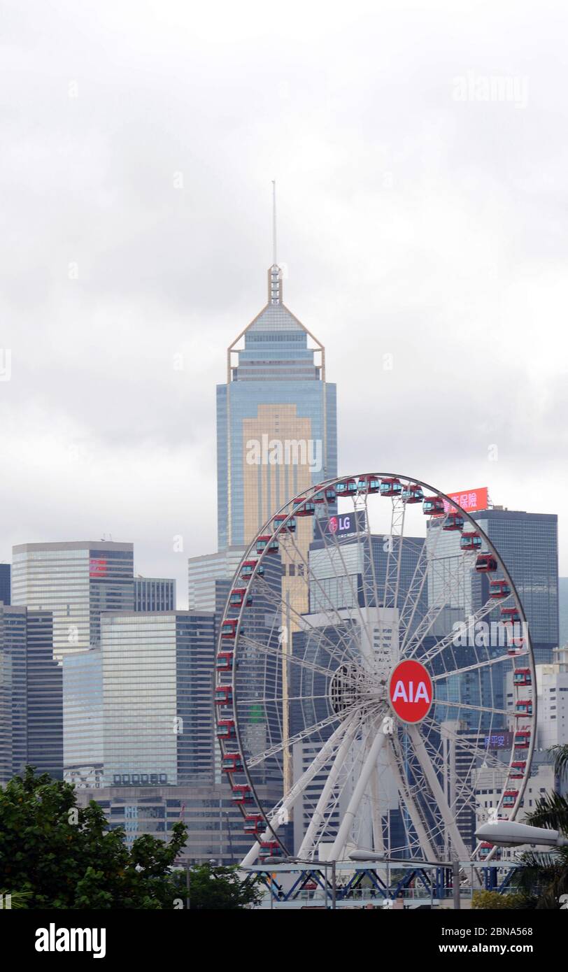 The Wan Chai tower with the AIA Ferris wheel in Hong Kong Stock Photo ...