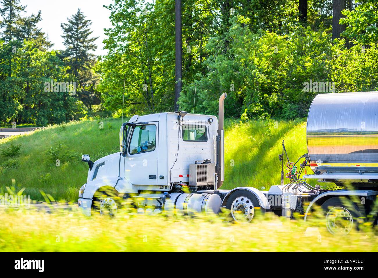 Powerful day cab white industrial grade diesel big rig semi truck ...