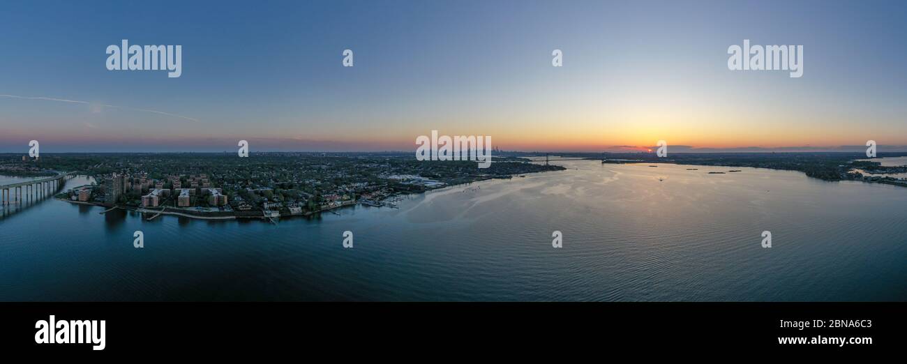 Aerial view of Queens in New York City at sunset with the George ...