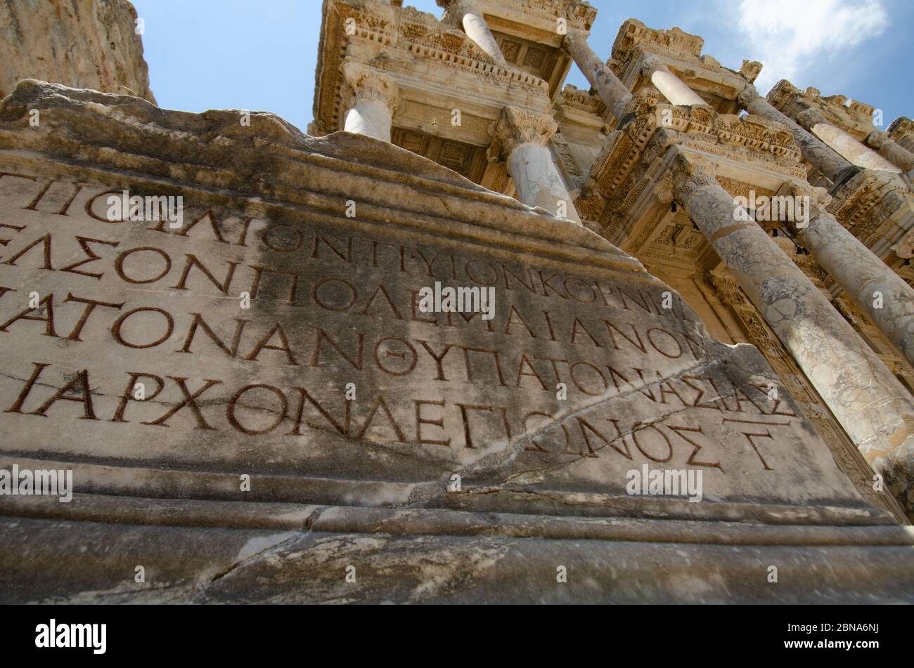 Low angle shot of an ancient greek sign and ruins of a temple Stock ...