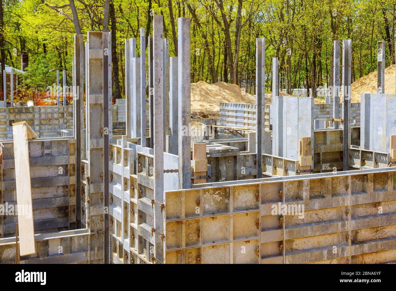 Installation of formwork under the foundation of a new house of a ...