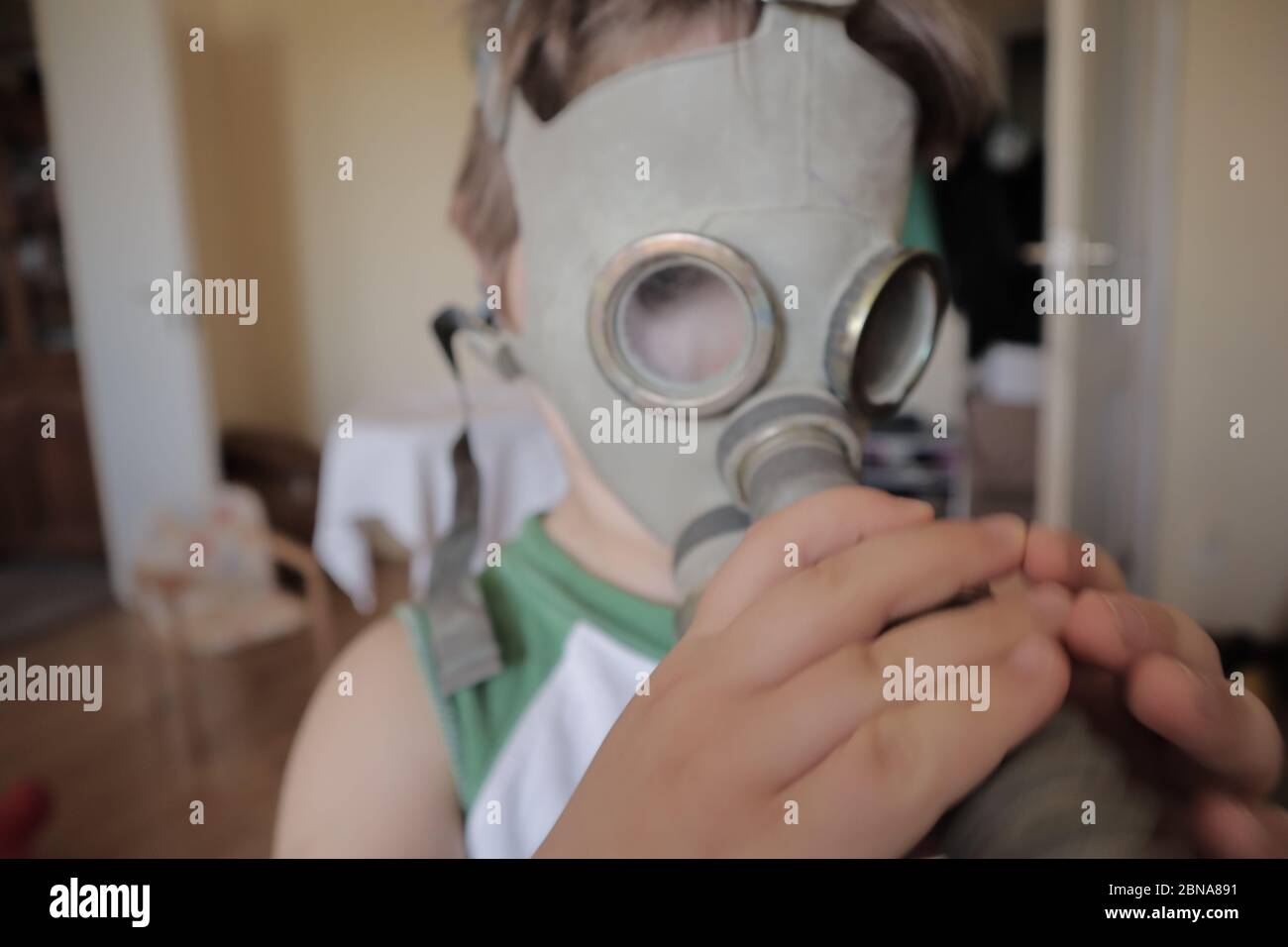 Boy wearing gas mask hi-res stock photography and images - Alamy