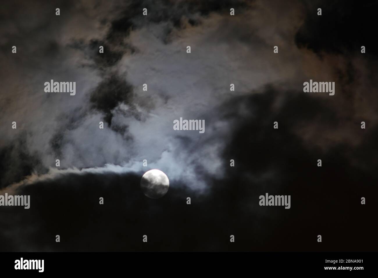 Full moon hidden by clouds hi-res stock photography and images - Alamy