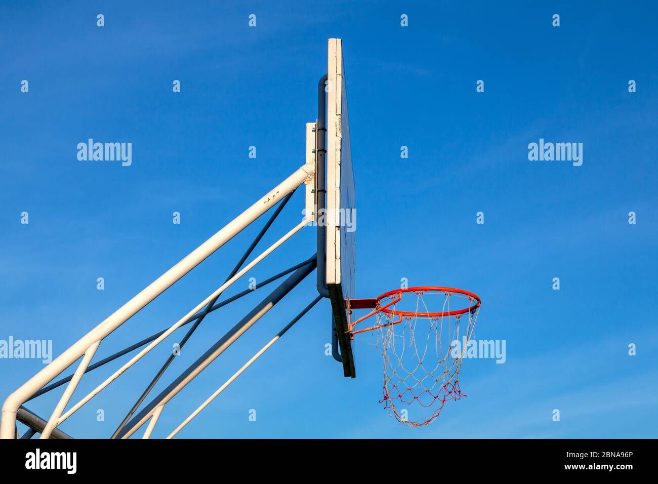 Side view Basketball hoop with clear blue sky Stock Photo - Alamy