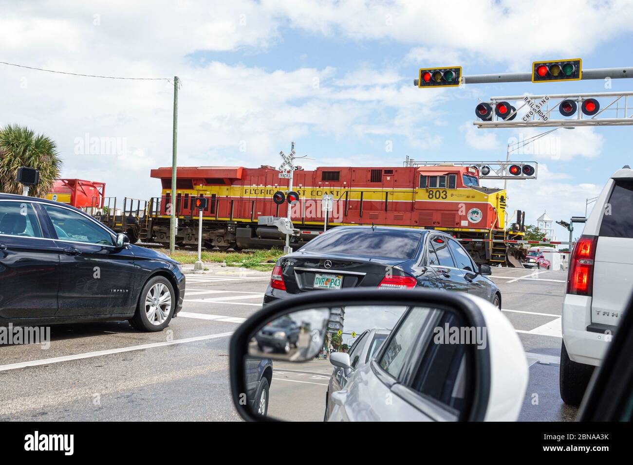 Railroad crossing gates down passing train hi-res stock photography and ...