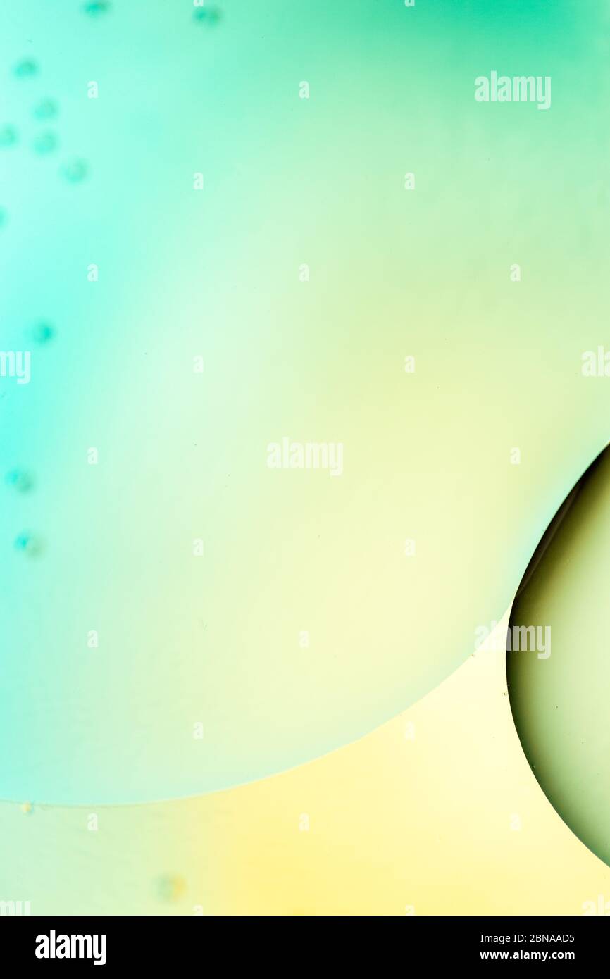 Vertical graphic illustration of light green and dirty green circles on ...