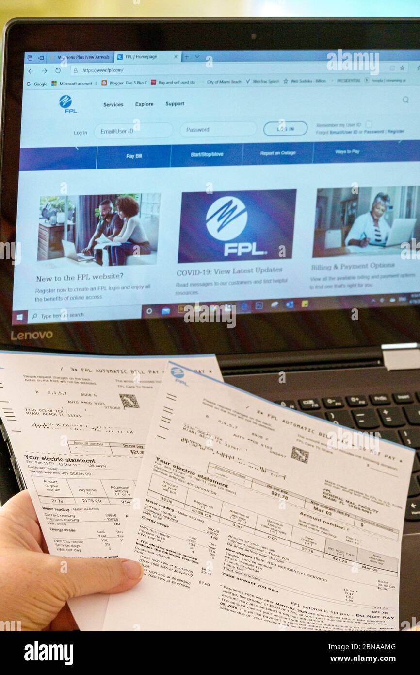 Miami Beach Florida,North Beach,laptop computer screen,web site,hand holding,screen,utility bill ...