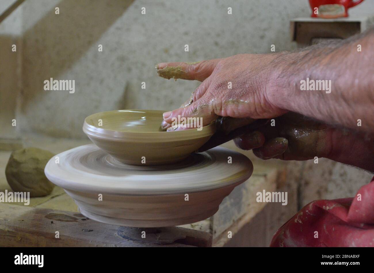 Selective focus shot of a person making pottery with clay Stock Photo ...