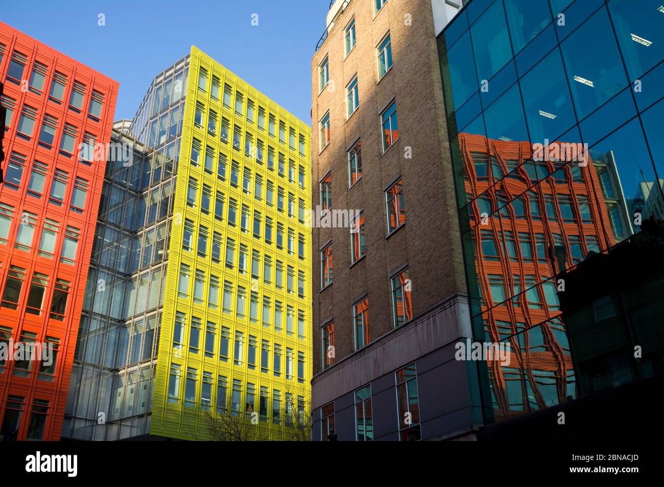 Colourful building of Central Saint Giles, reflected in the windows of ...