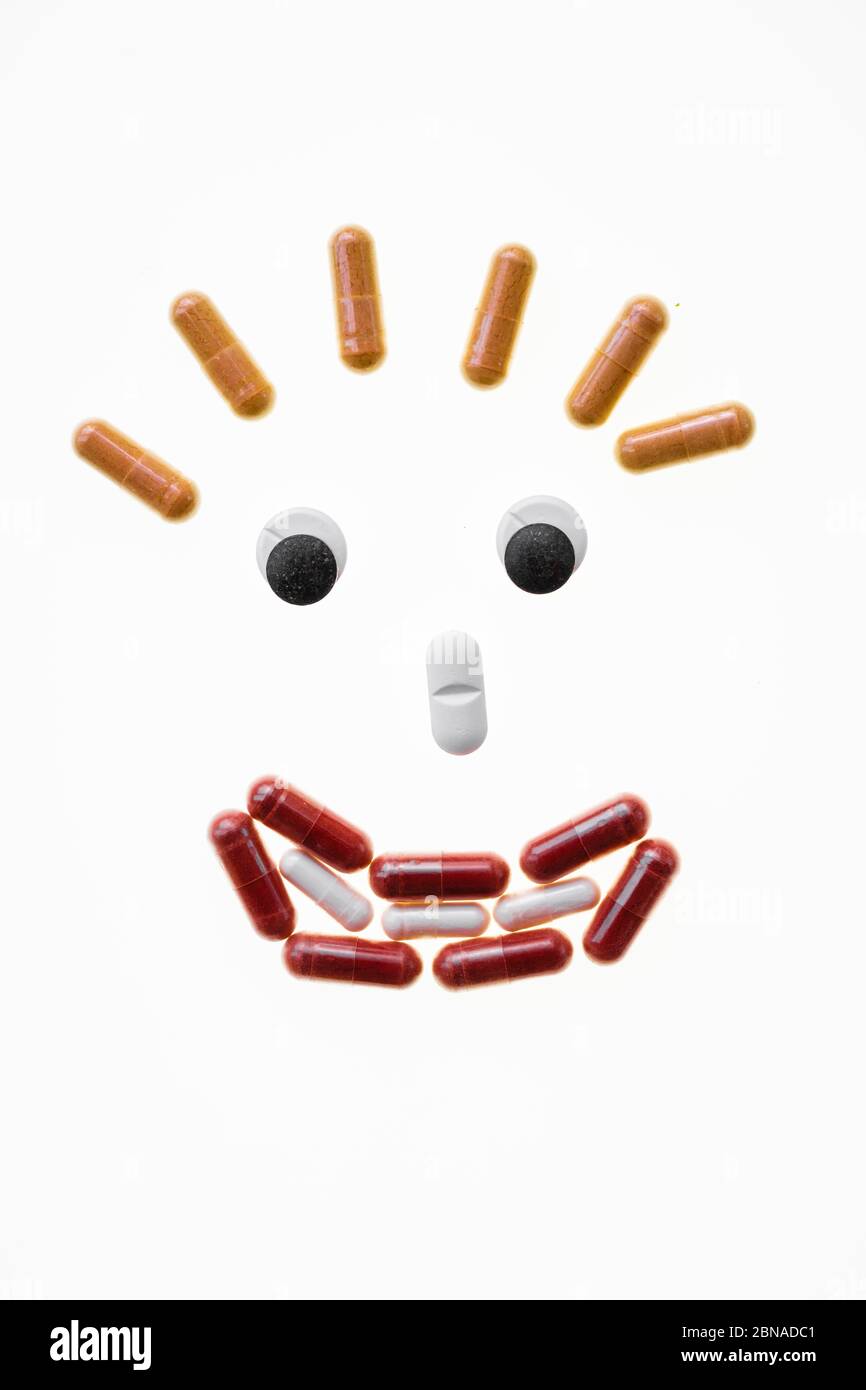 Various tablets form a happy, cheerful face, against a white background ...