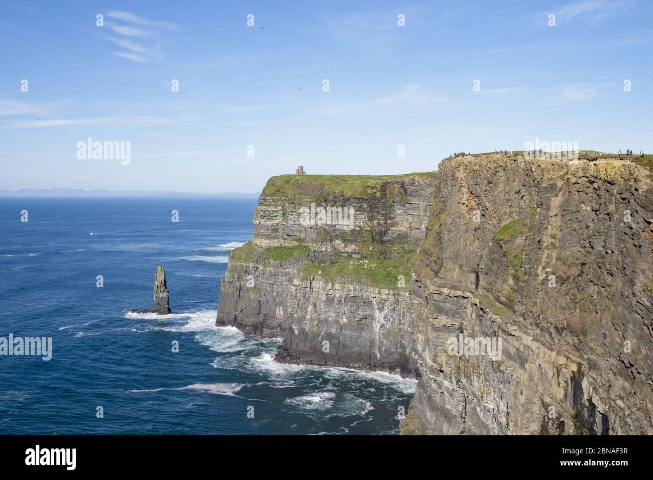 Mesmerizing scene of the ocean waves crashing into cliffs of Moher ...