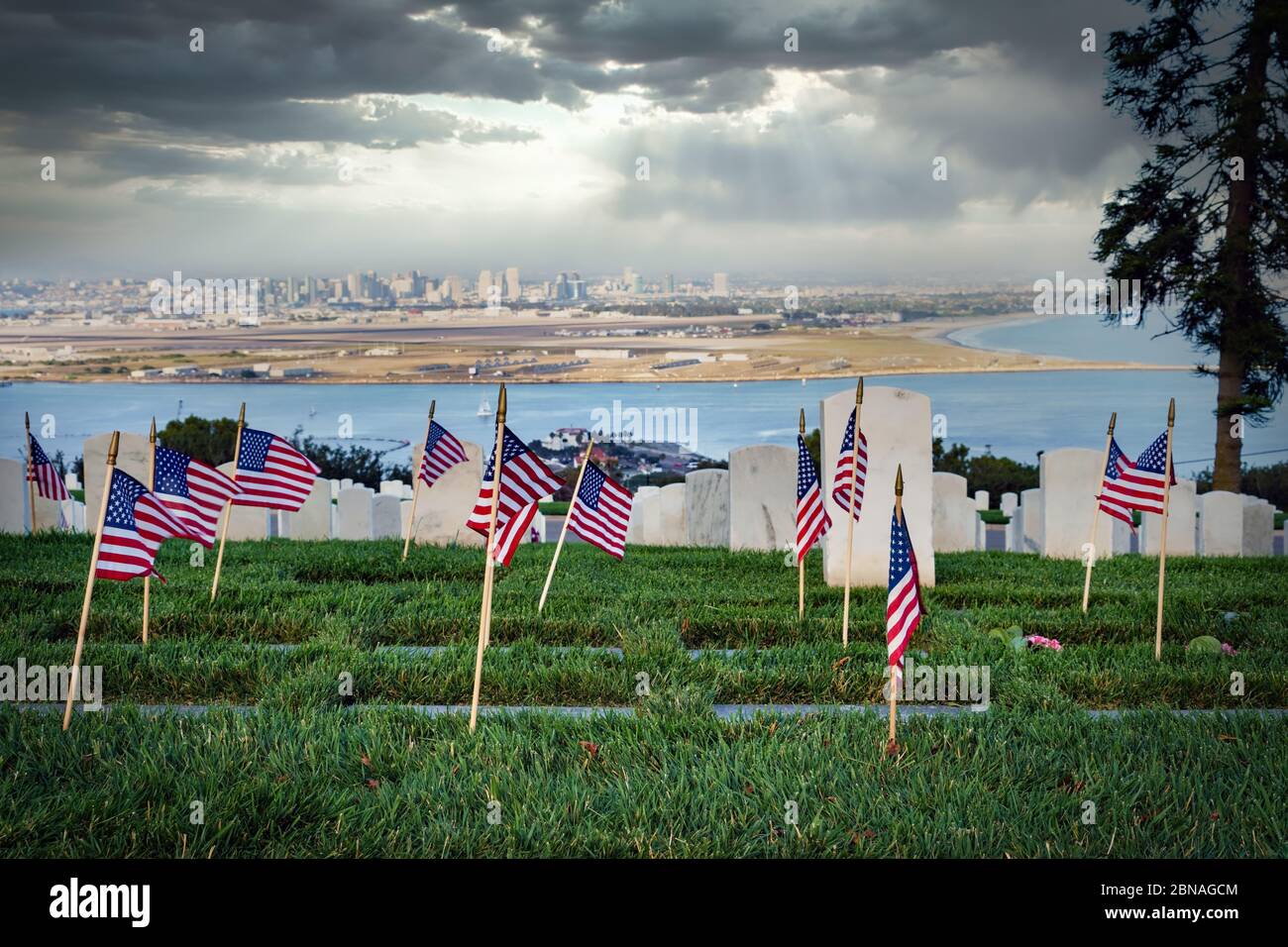 American Flags on graves on Memorial Day at a national cemetery in ...