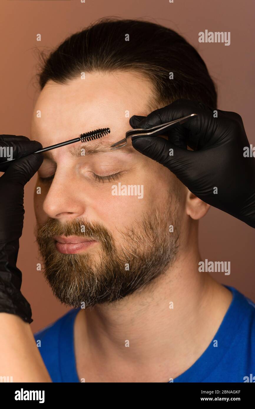 Eyebrow threading men hi-res stock photography and images - Alamy