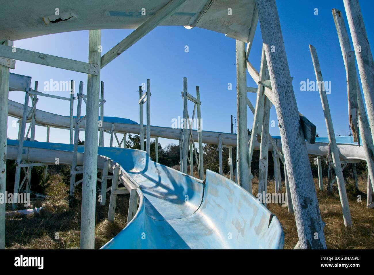 Old blue abandoned water slide Stock Photo - Alamy