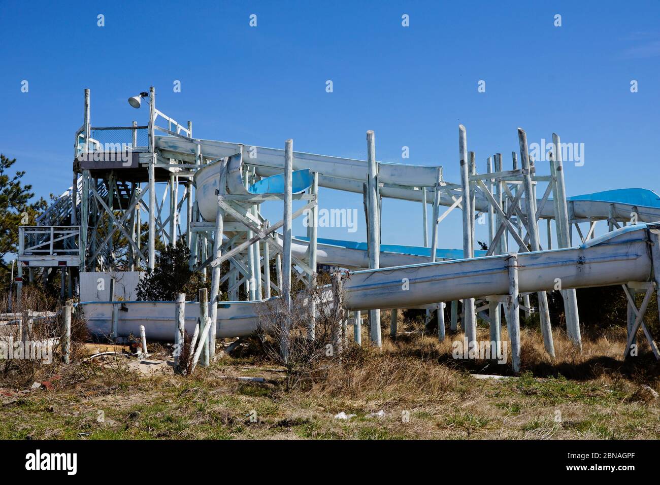 Old blue abandoned water slide Stock Photo - Alamy