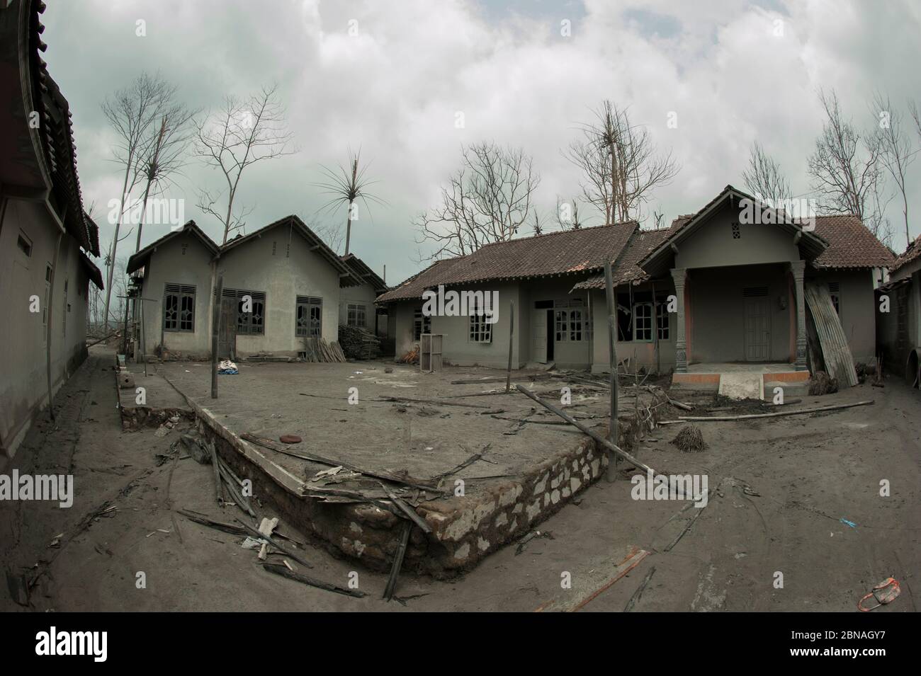 Debris and damaged house from ash from Mount Merapi volcano eruption ...