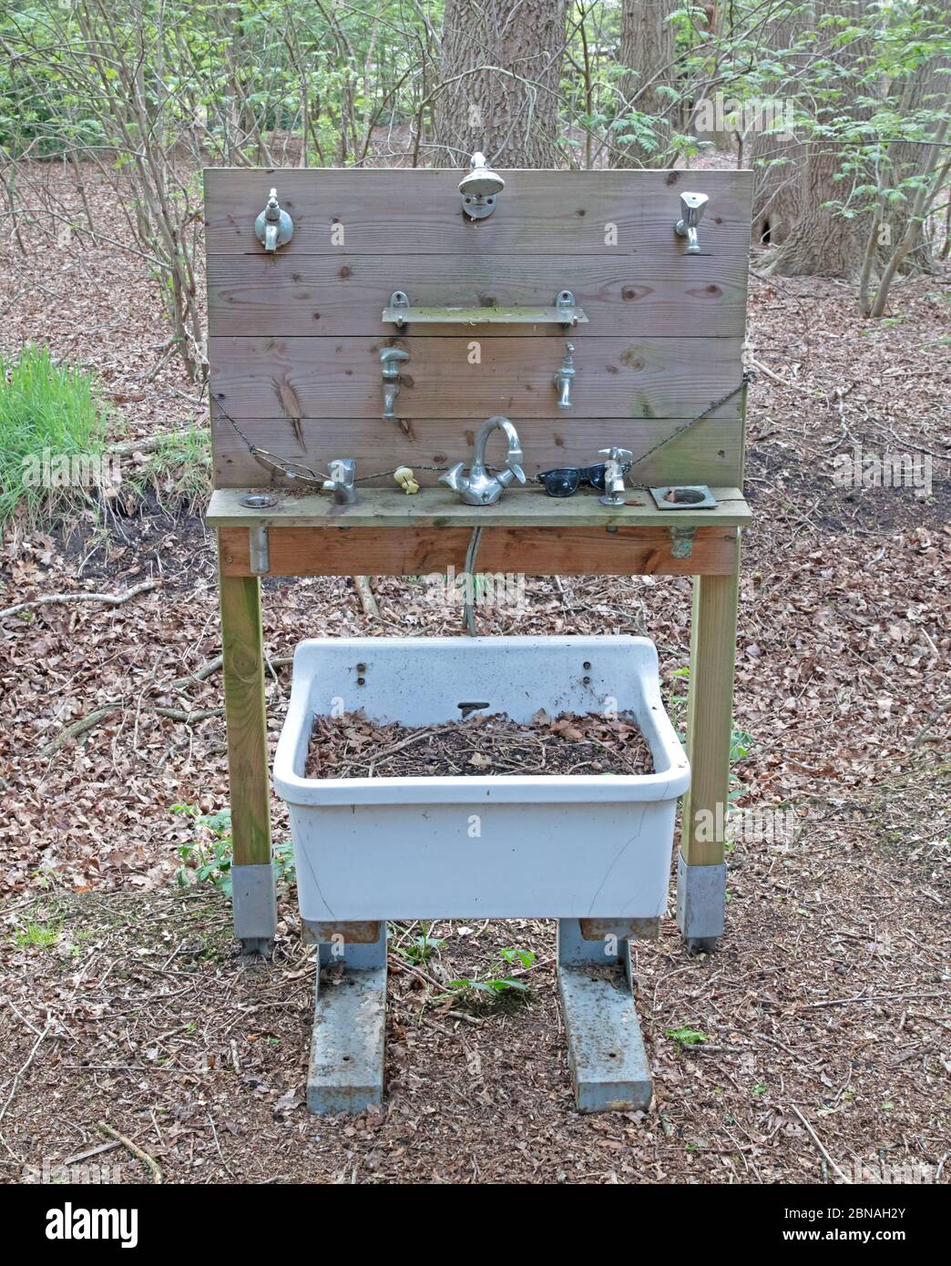 Funny tap faucet, in the middle of the forest Stock Photo - Alamy