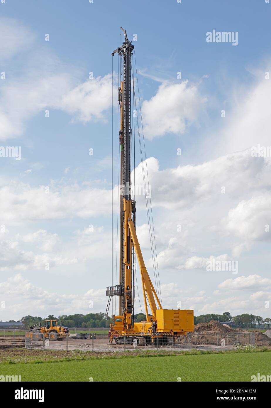 Foundation drill machine in the dutch flat landscape Stock Photo - Alamy