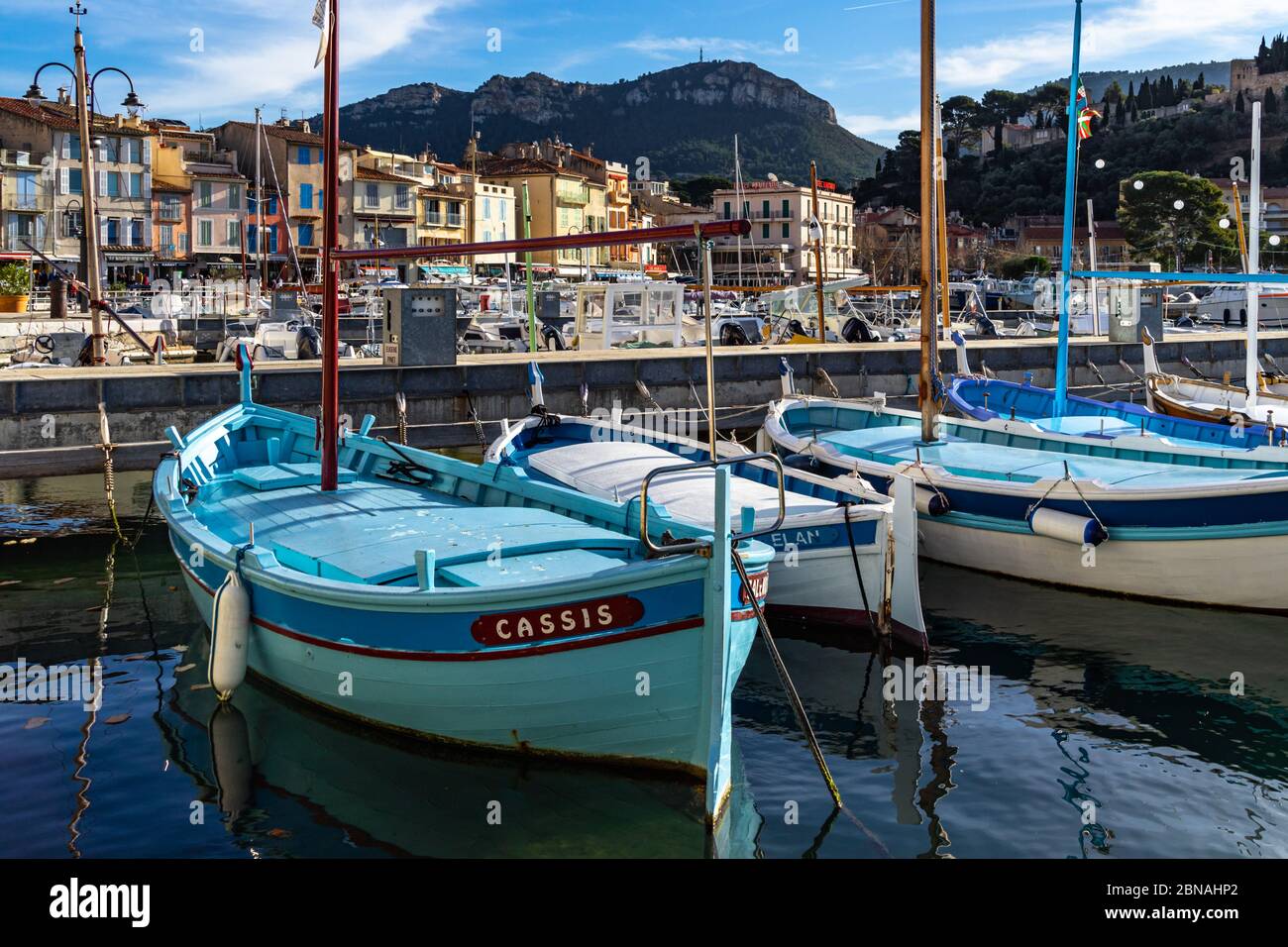 Colorful boats moored at the picturesque port of Cassis, a famous ...