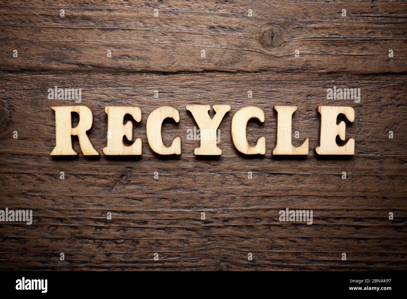 Recycle word on a wood table Stock Photo - Alamy
