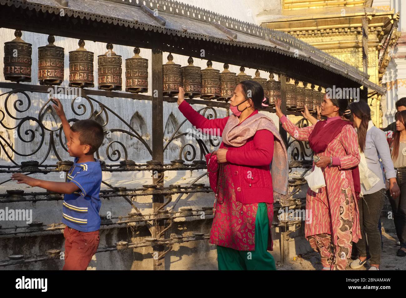 During their circumambulations of the iconic Swayambhunath Temple ...