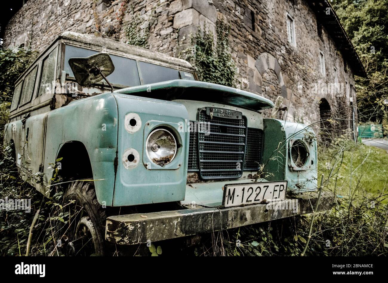 KARRIKA, SPAIN - Aug 06, 2016: Vintage Land Rover abandoned eaten by ...