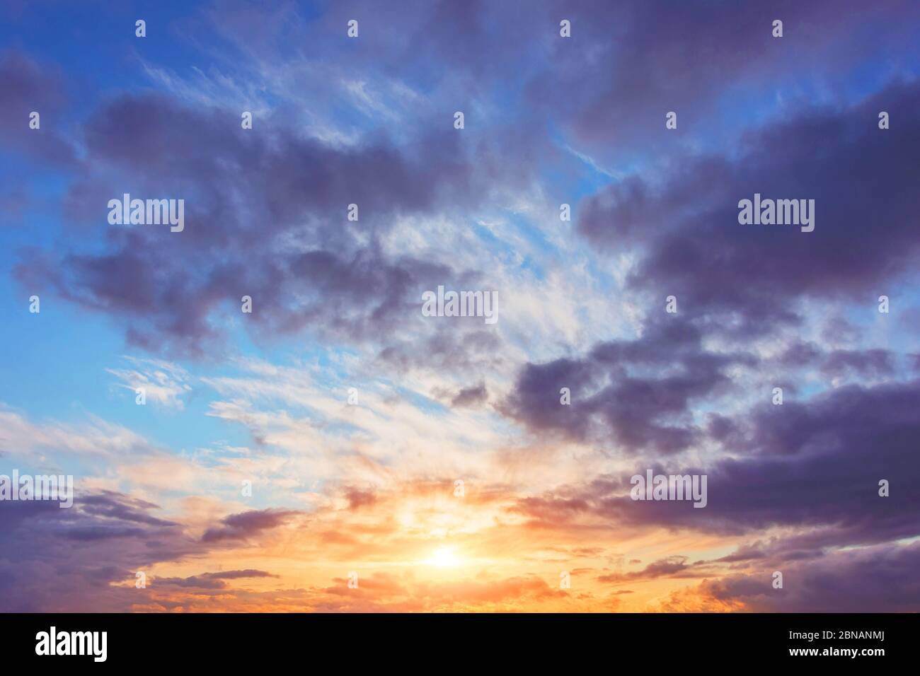 Beautiful vibrant sunset sky with clouds of different tiers and the ...