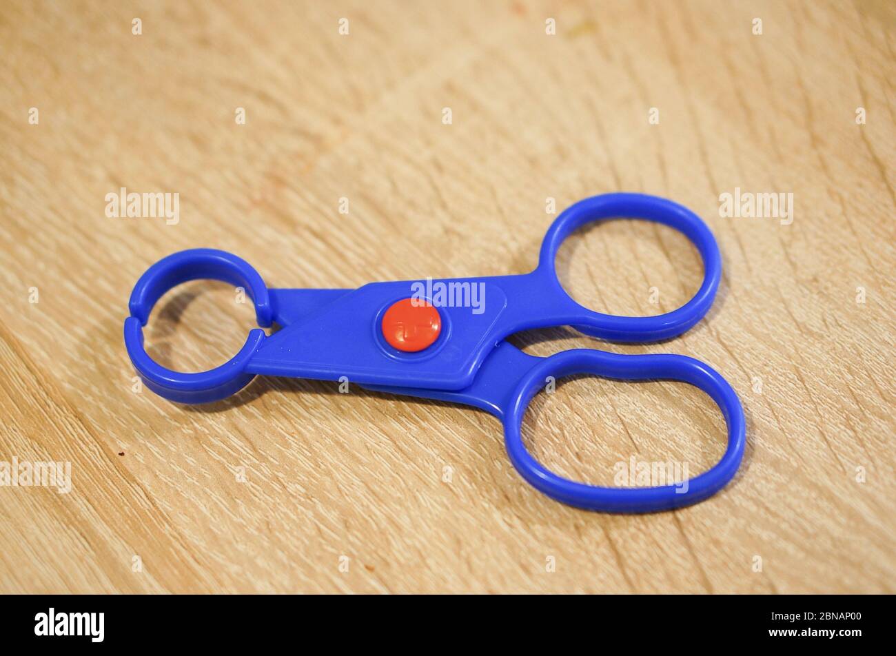Blue plastic toy surgery pliers Stock Photo - Alamy