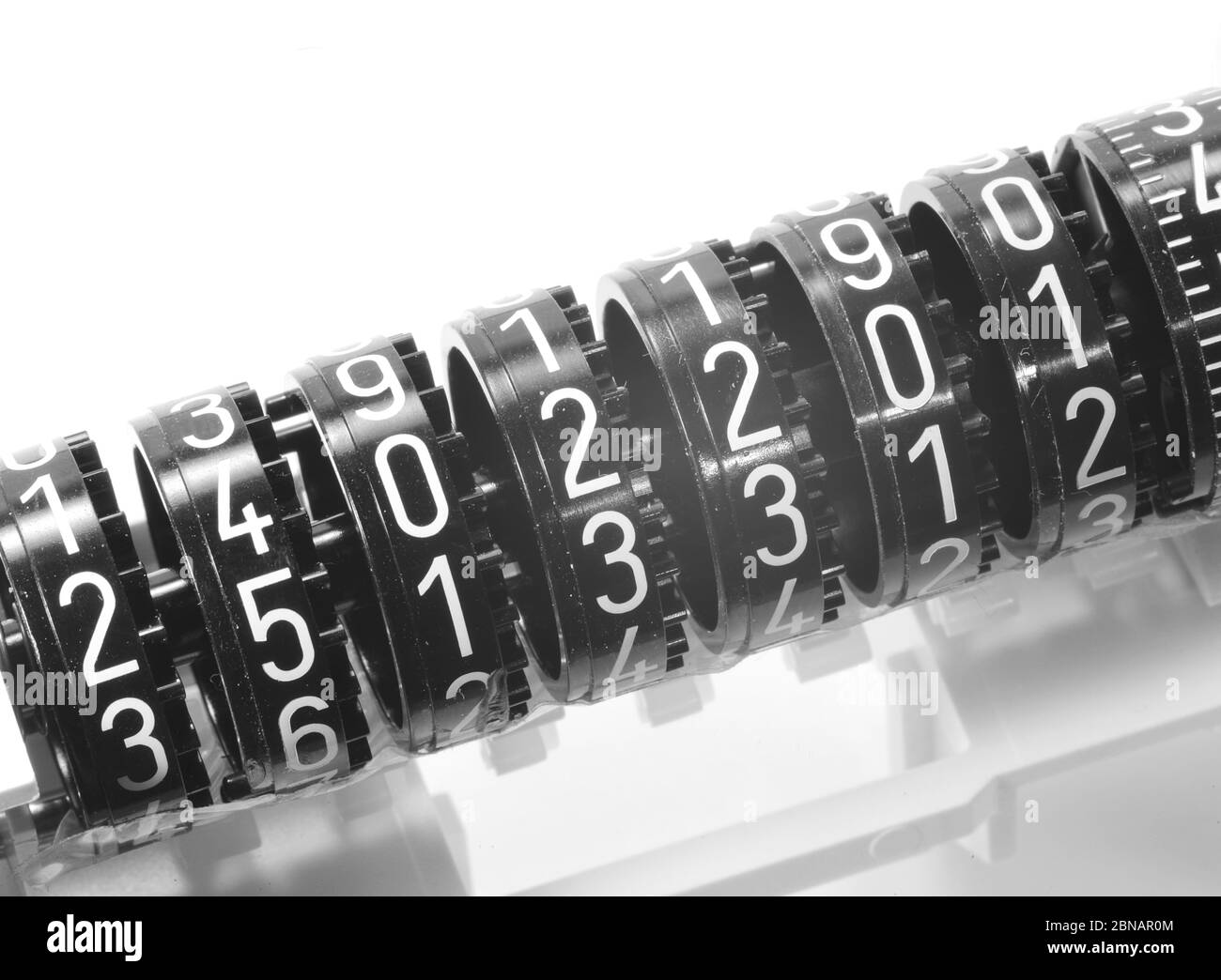 many numbers on an old analog type counter on a white background Stock ...