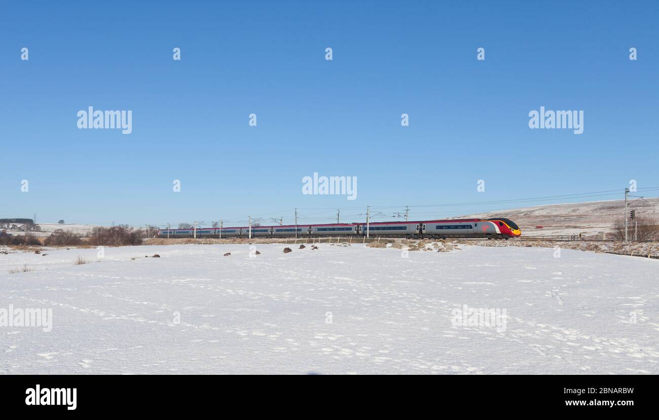 Virgin trains Alstom class 390 Pendolino train passing Shap wells on ...