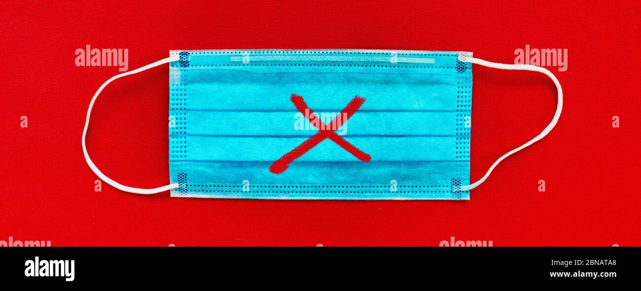 COVID-19 mask with red X mark written on it. People against compulsory ...